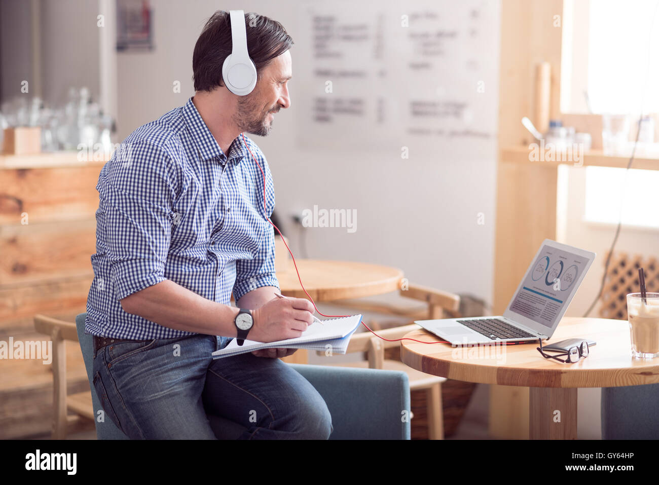 Handsome man using modern gadgets Stock Photo - Alamy