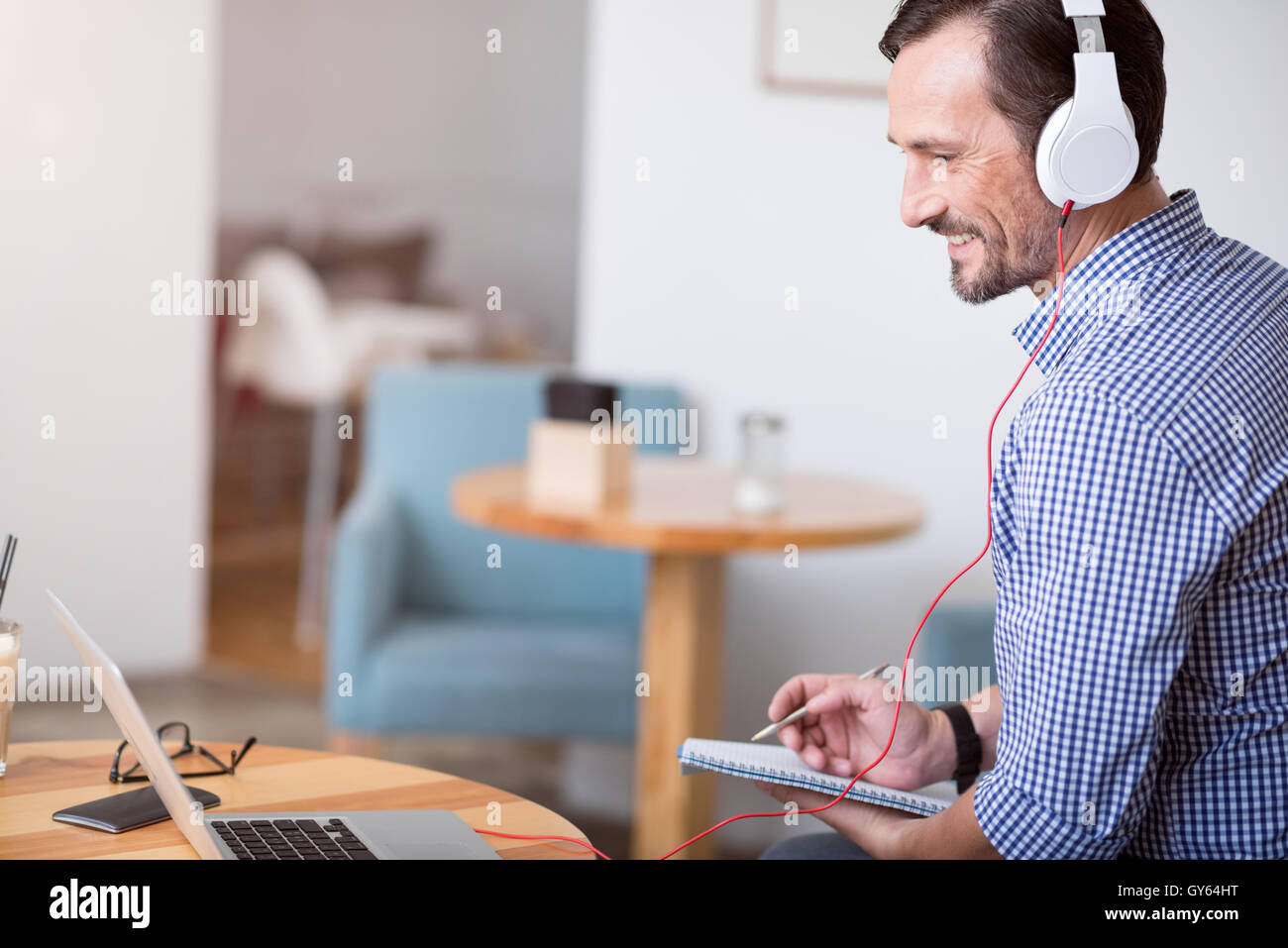Handsome man using some gadgets Stock Photo - Alamy
