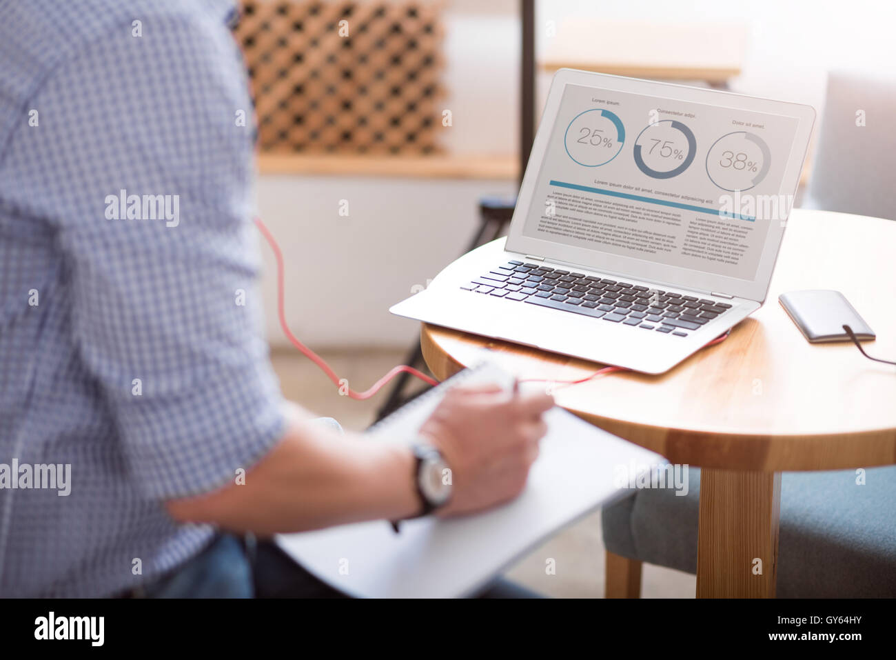 One man writing something down Stock Photo - Alamy