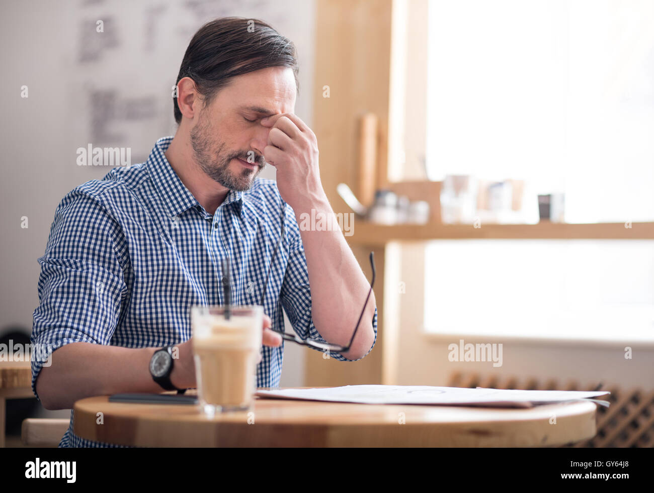 Attractive man reading a newspaper Stock Photo - Alamy