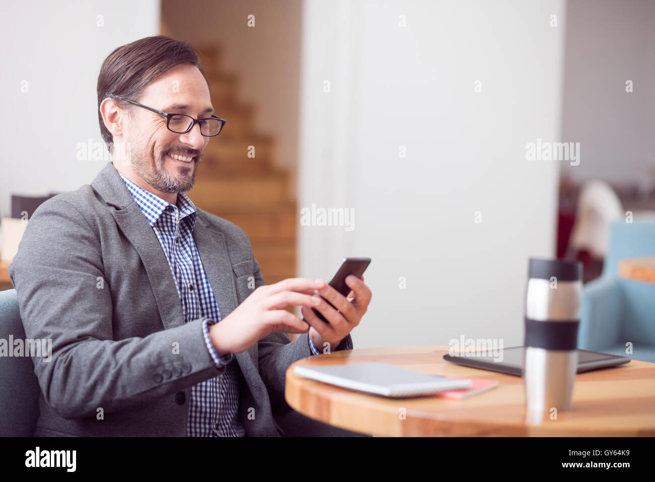 Handsome man using smart phone Stock Photo - Alamy