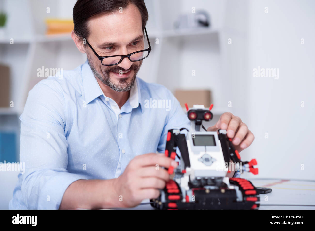 Smart scientist working on a robot production Stock Photo - Alamy