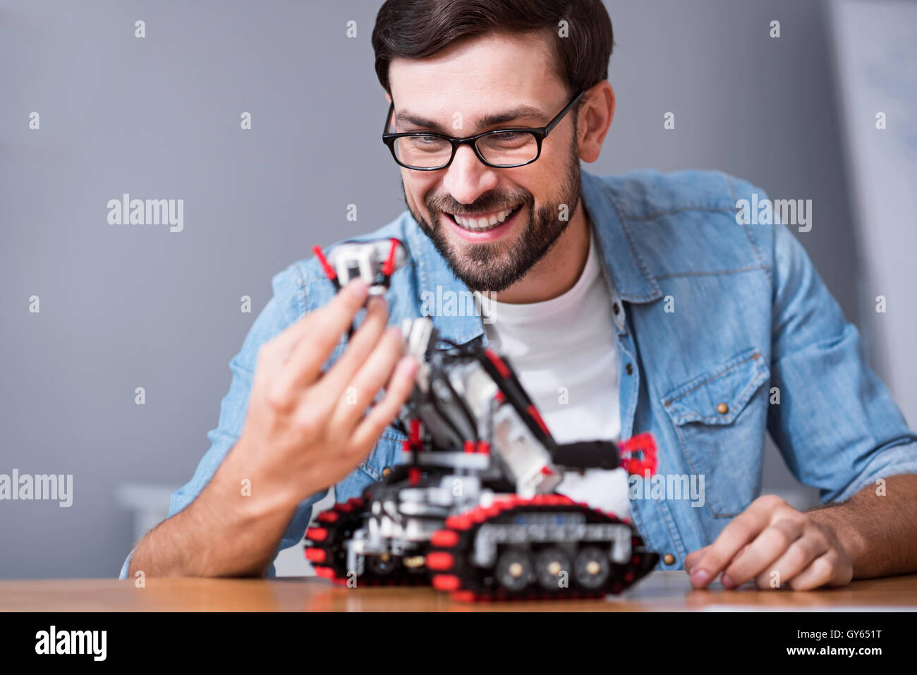 Positive engineer using robot Stock Photo - Alamy Positive engineer using robot Stock Photo - Alamy