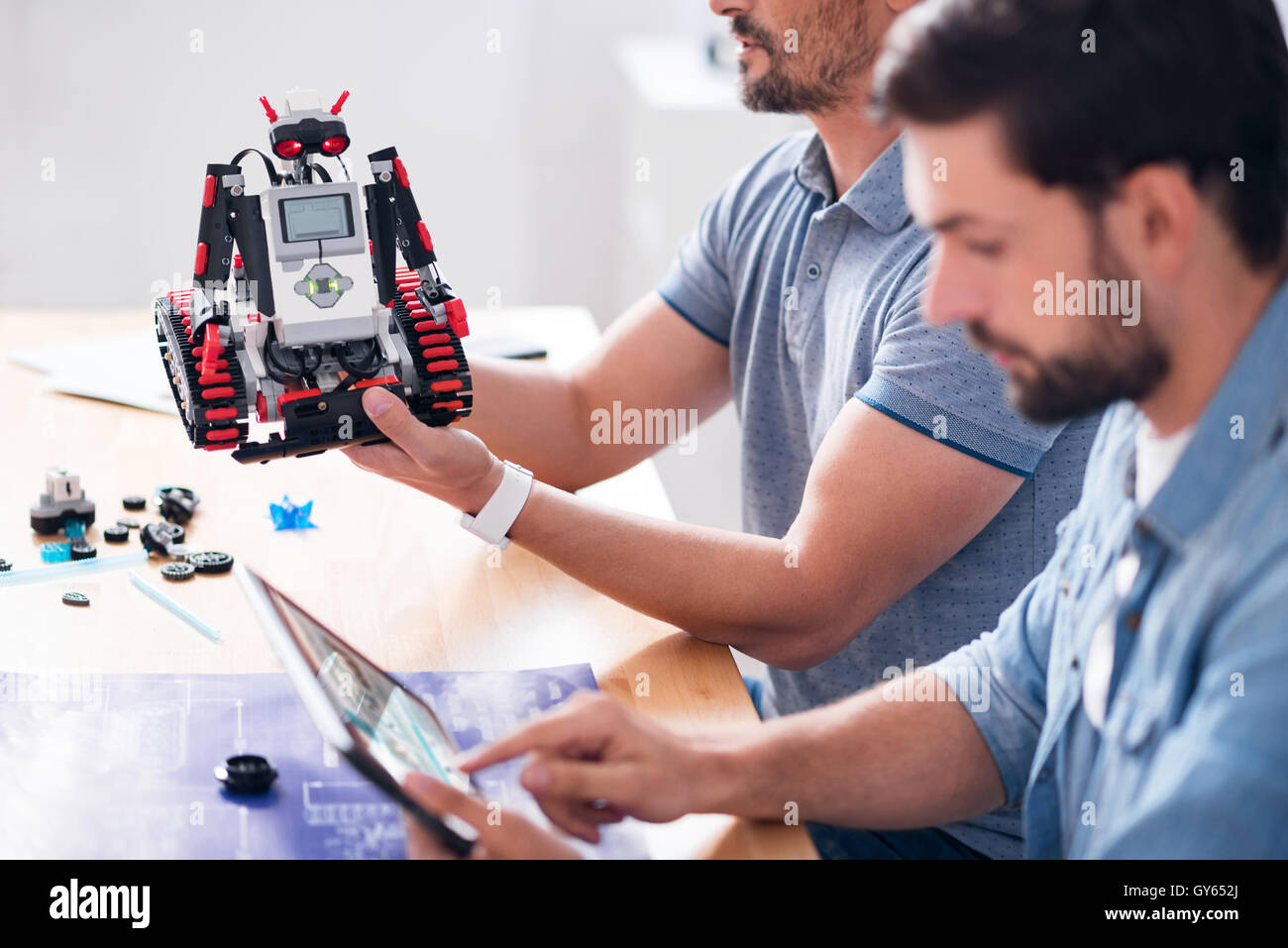 Professional engineers sitting at the table Stock Photo - Alamy