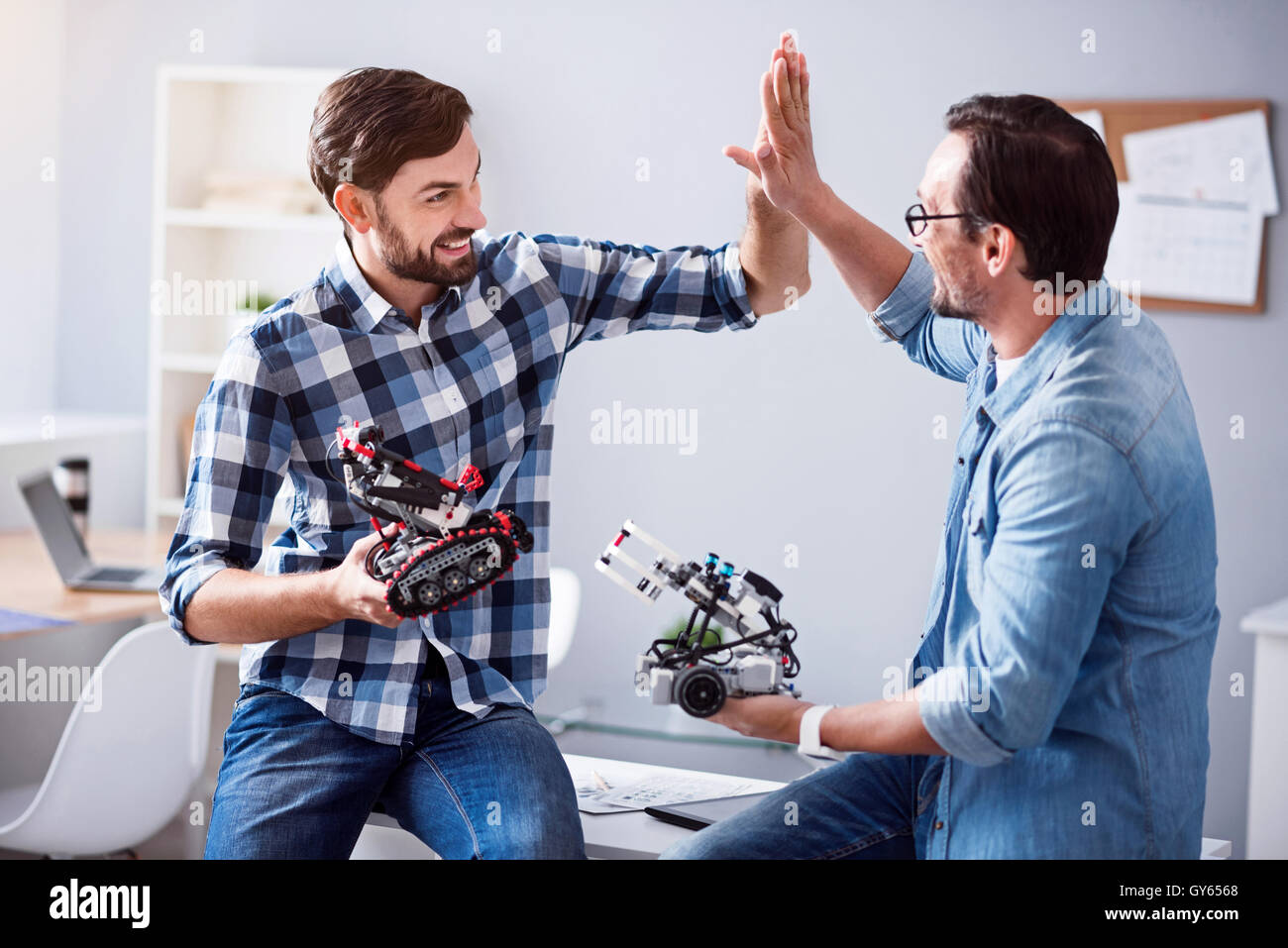 Positive colleague working in the office Stock Photo - Alamy