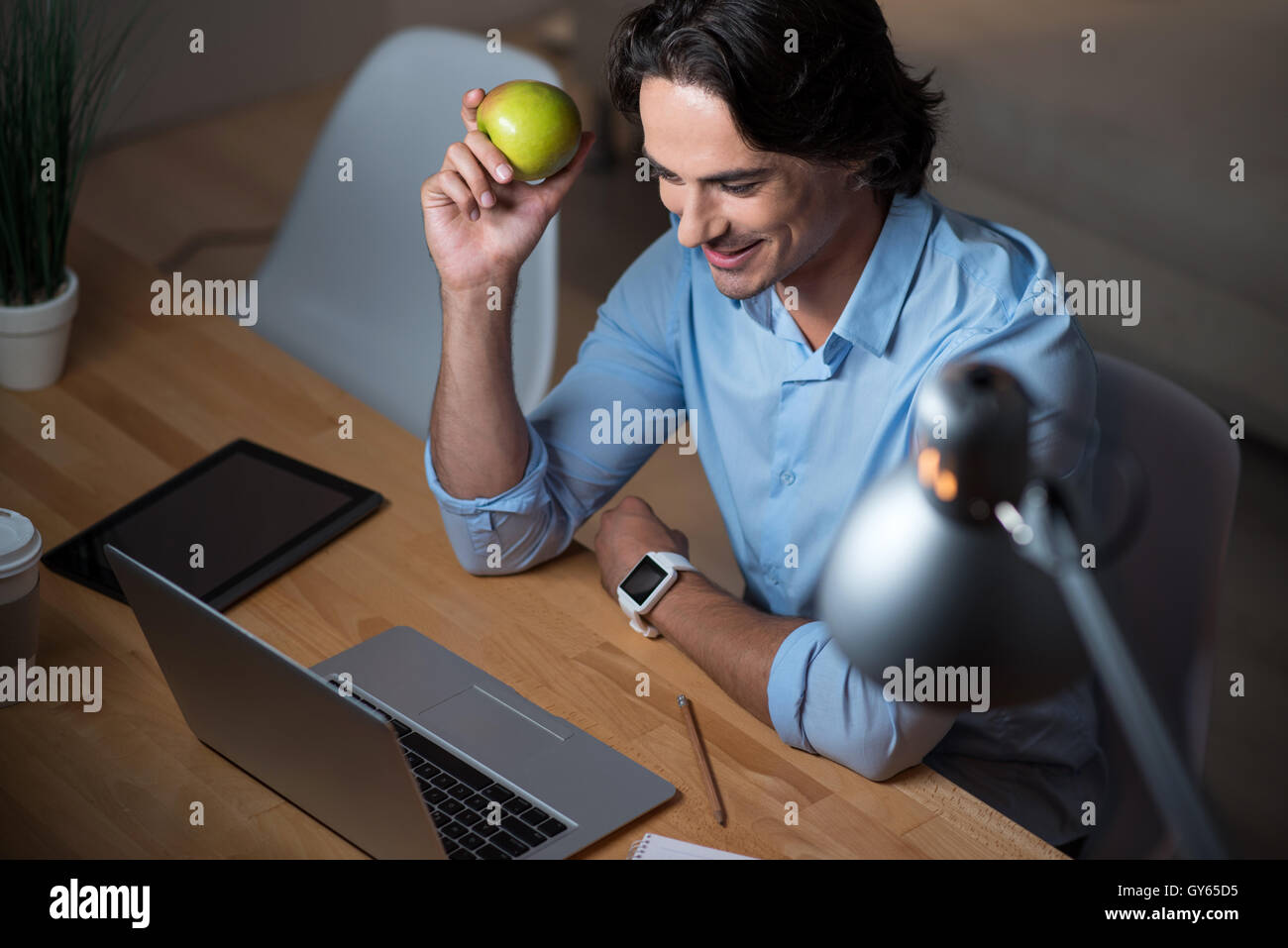 Handsome young man using laptop Stock Photo - Alamy
