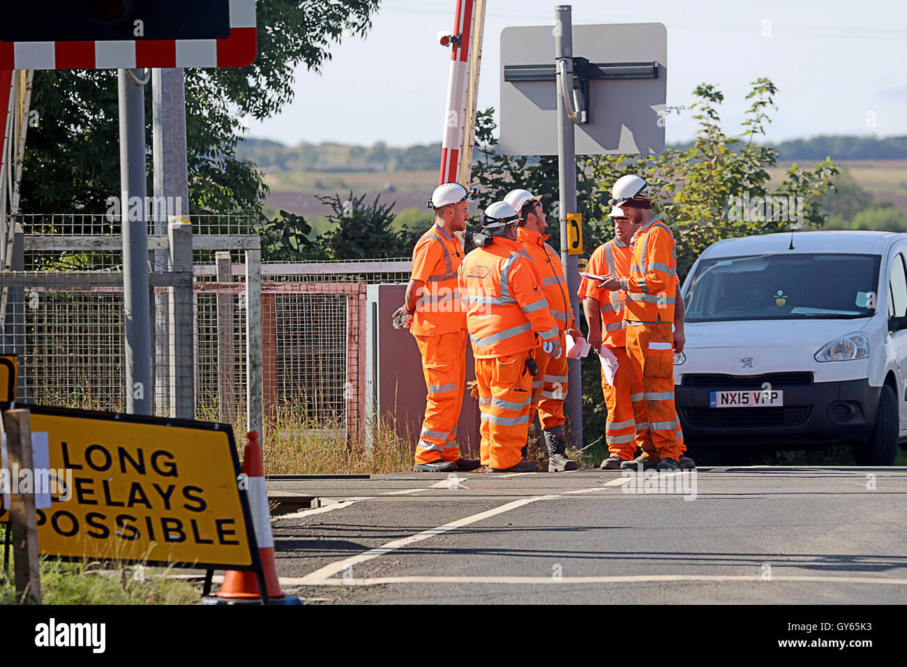 Five men working together on railway tracks Stock Photo - Alamy