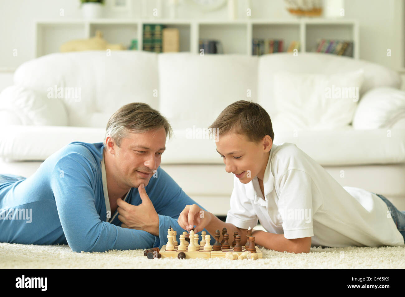father and son playing chess Stock Photo - Alamy