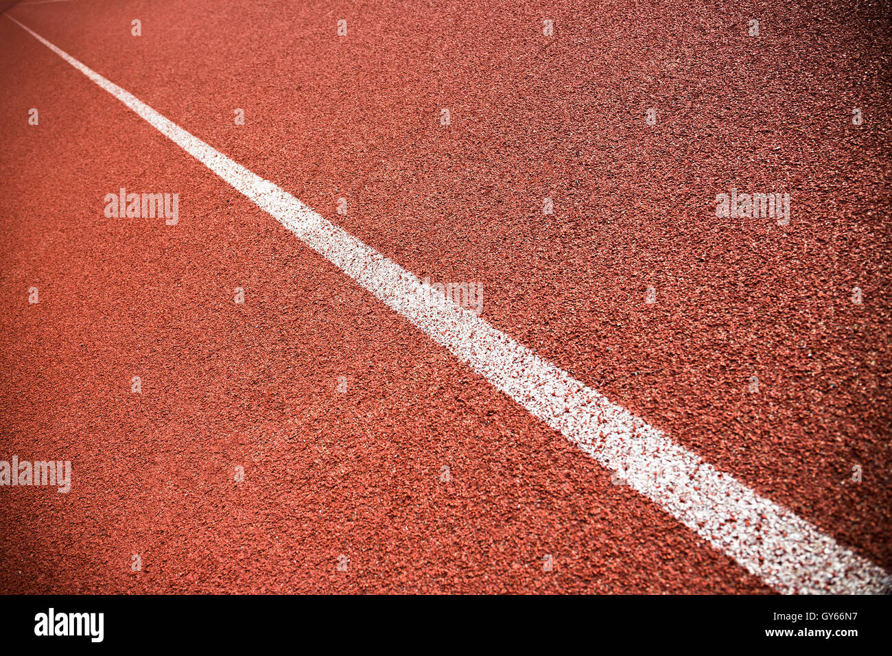 Red lane on a running track Stock Photo - Alamy