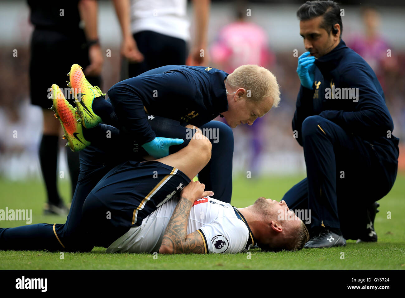 Tottenham Hotspur's Toby Alderweireld is treated for an injury during ...