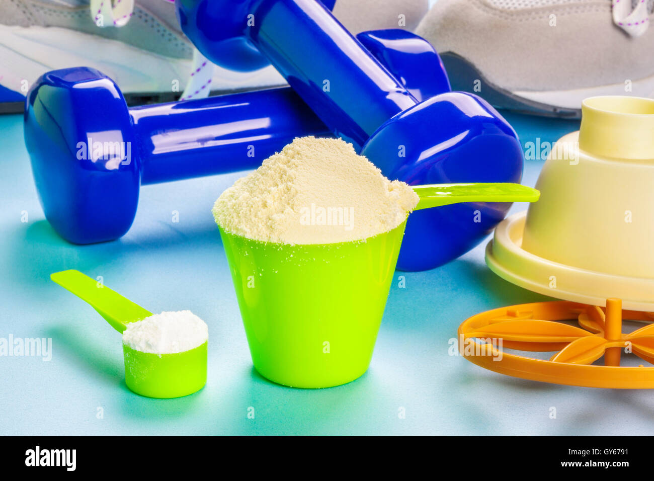 Scoops with whey protein and creatine Stock Photo - Alamy