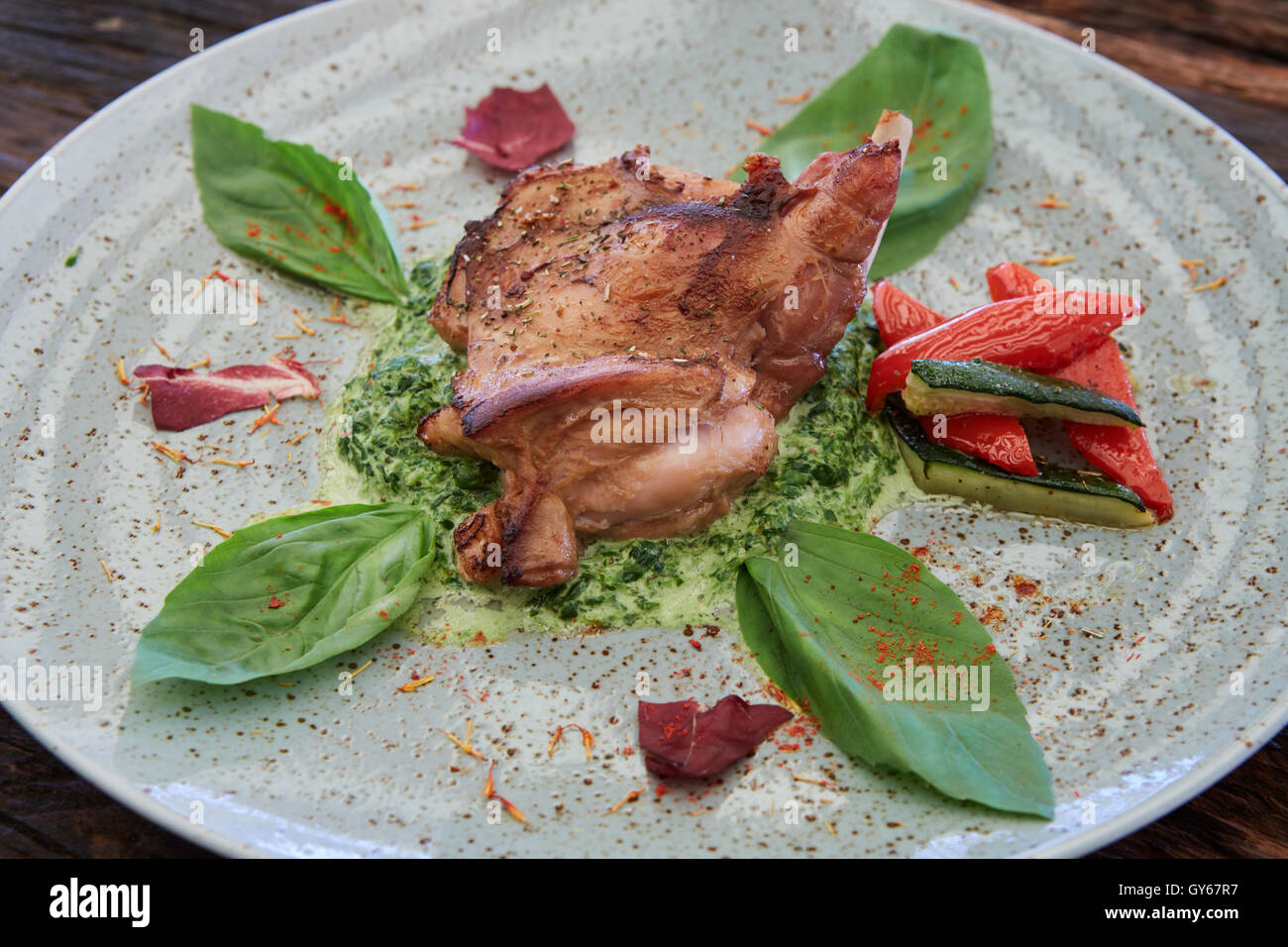 cooked rabbit meat with spinach and raisins Stock Photo - Alamy