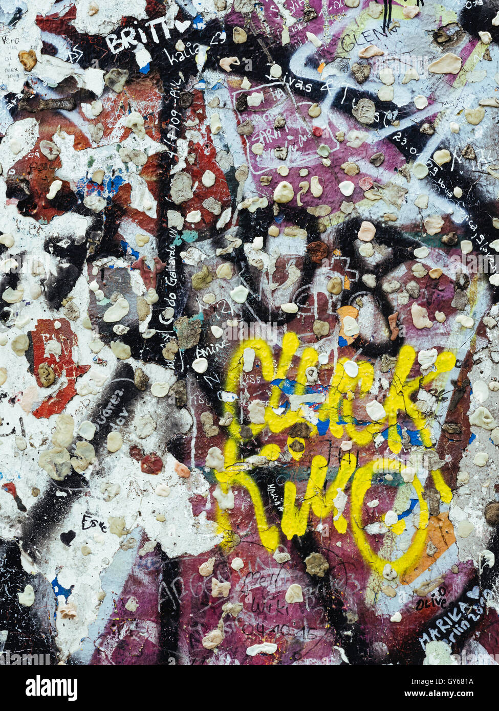Detail of graffiti and chewing gum covered segment of the Berlin Wall ...