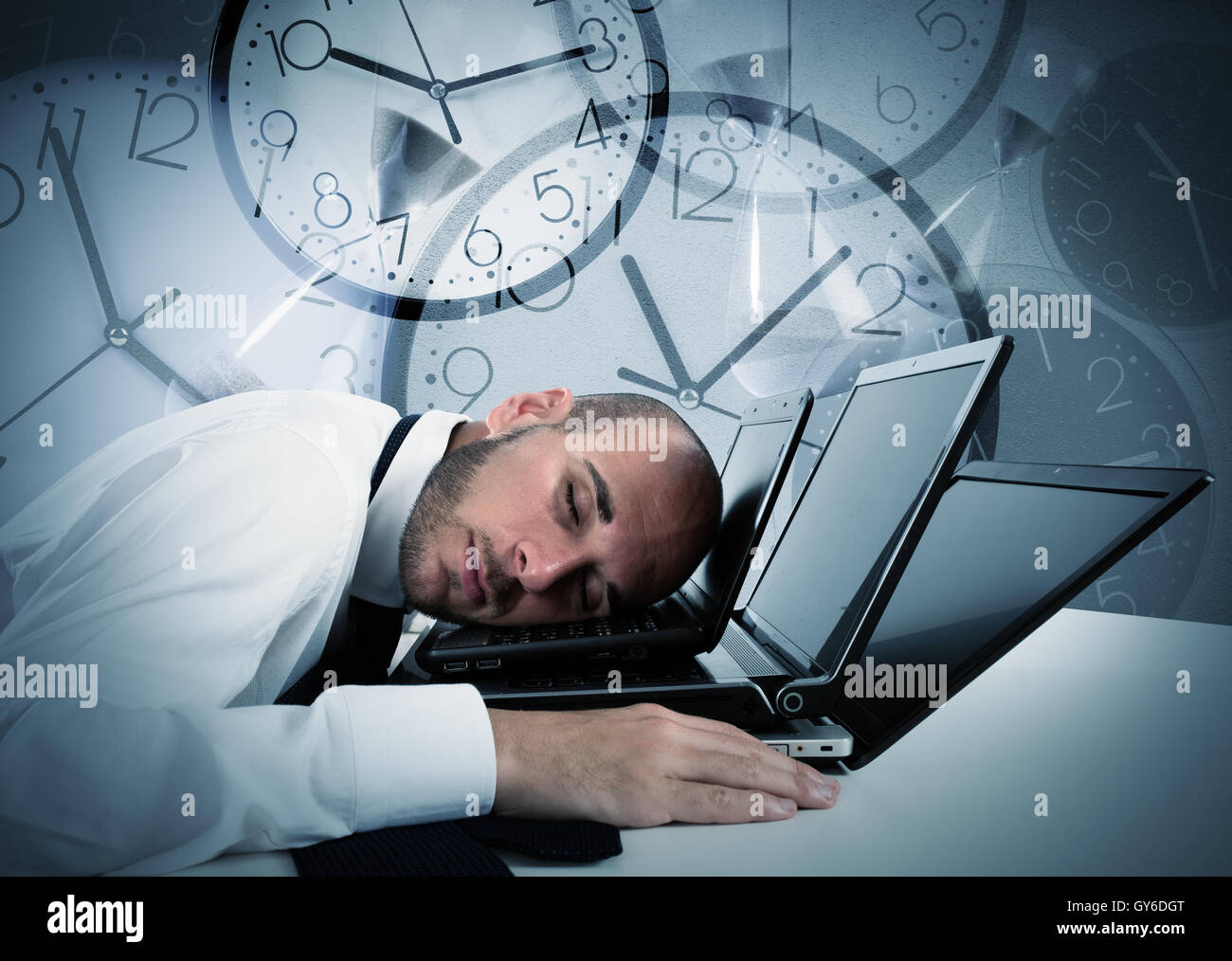 Businessman tired from overwork Stock Photo - Alamy