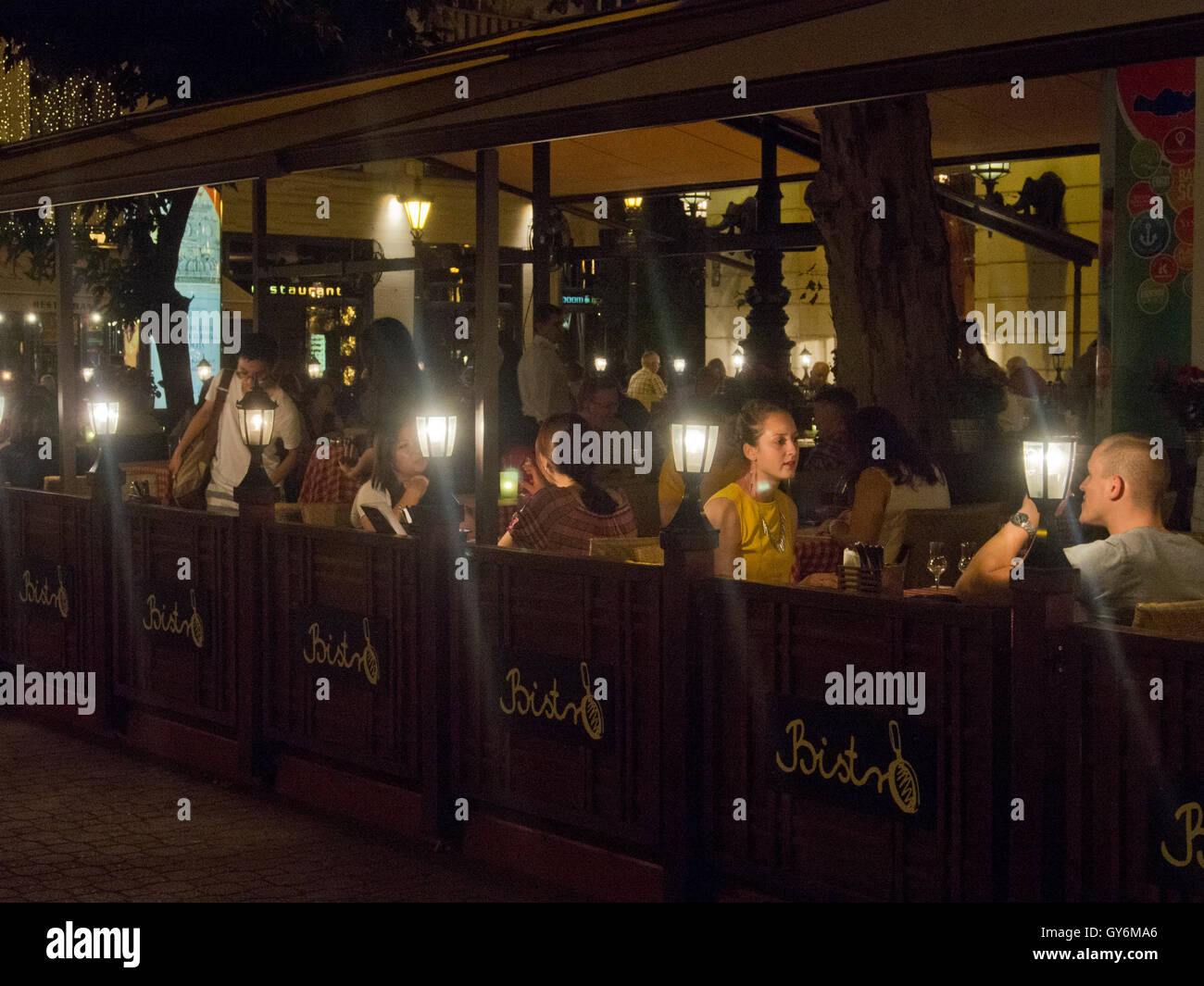 People eating out at night in a restaurant in the centre of Budapest ...