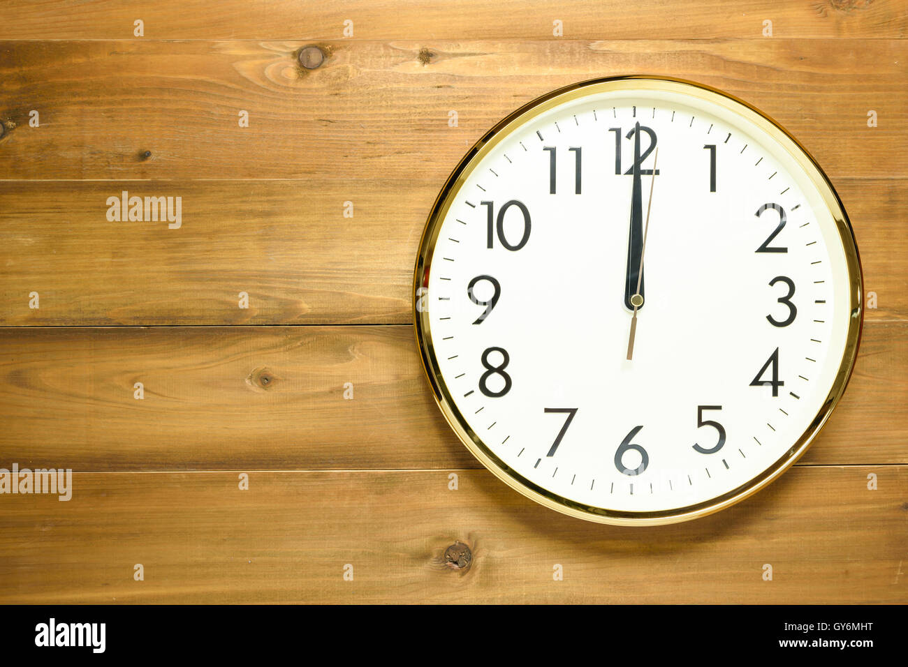 Wall Clock On The Wooden Wall At Time 12am Or 12pm Stock Photo Wall Clock On The Wooden Wall At Time 12am Or 12pm Stock Photo