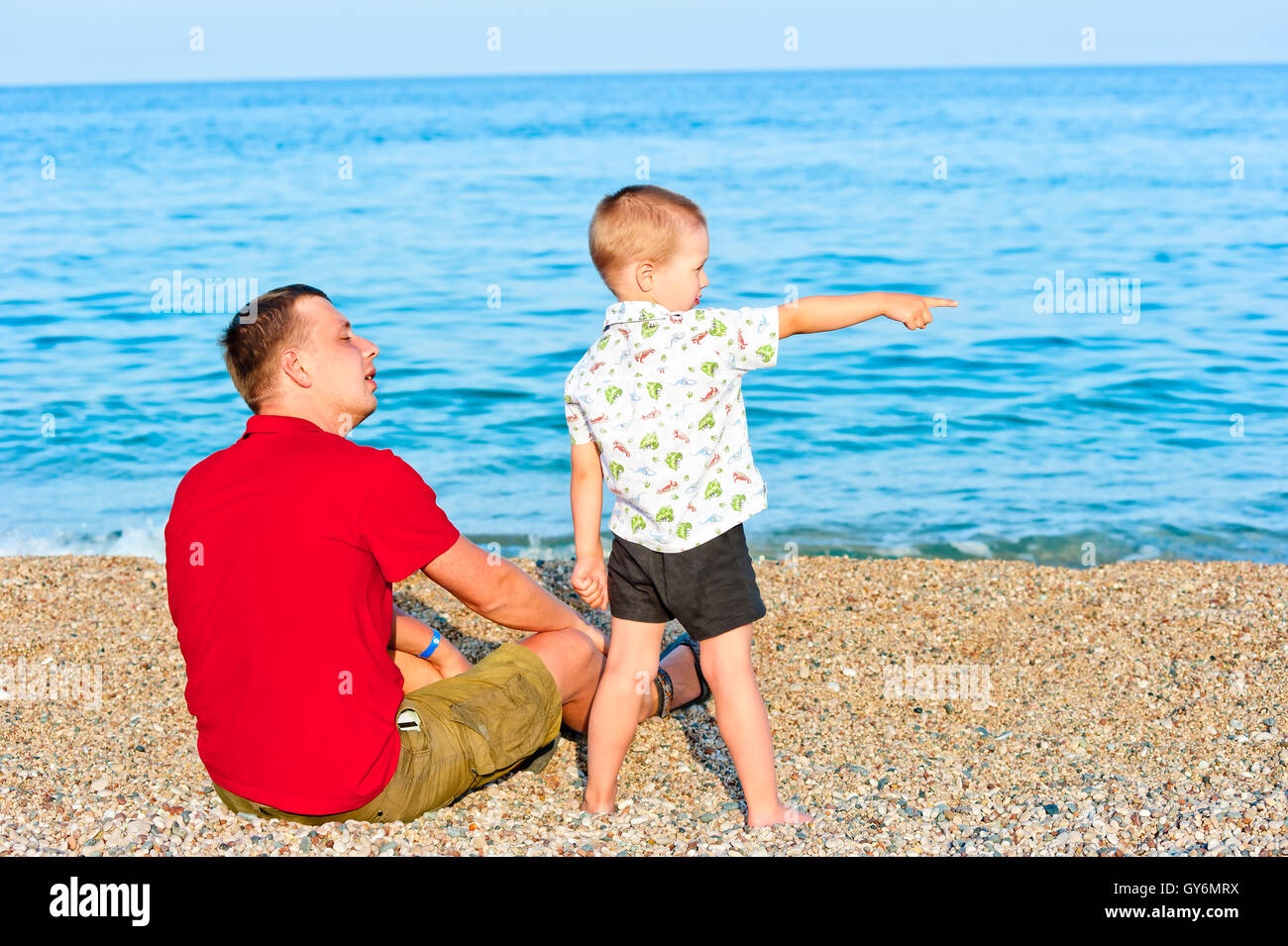 son standing next to his father, and that it shows him Stock Photo - Alamy