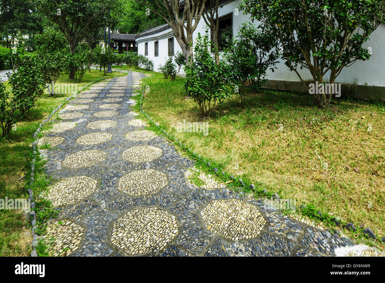 Pebble stone path in chinese garden Stock Photo - Alamy