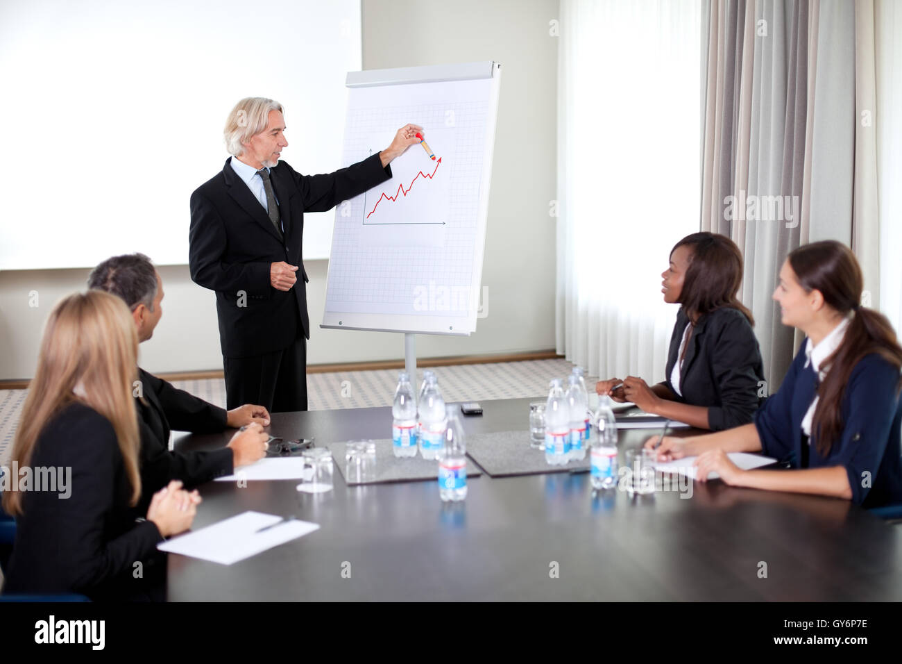 Business people holding a conference at the office Stock Photo - Alamy