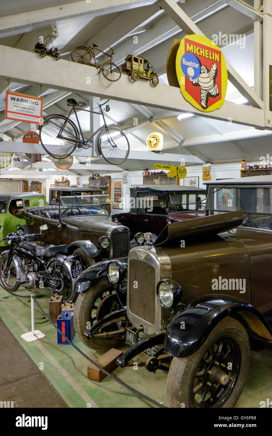 Vintage vehicles and memorabilia are displayed at a museum, preserving ...