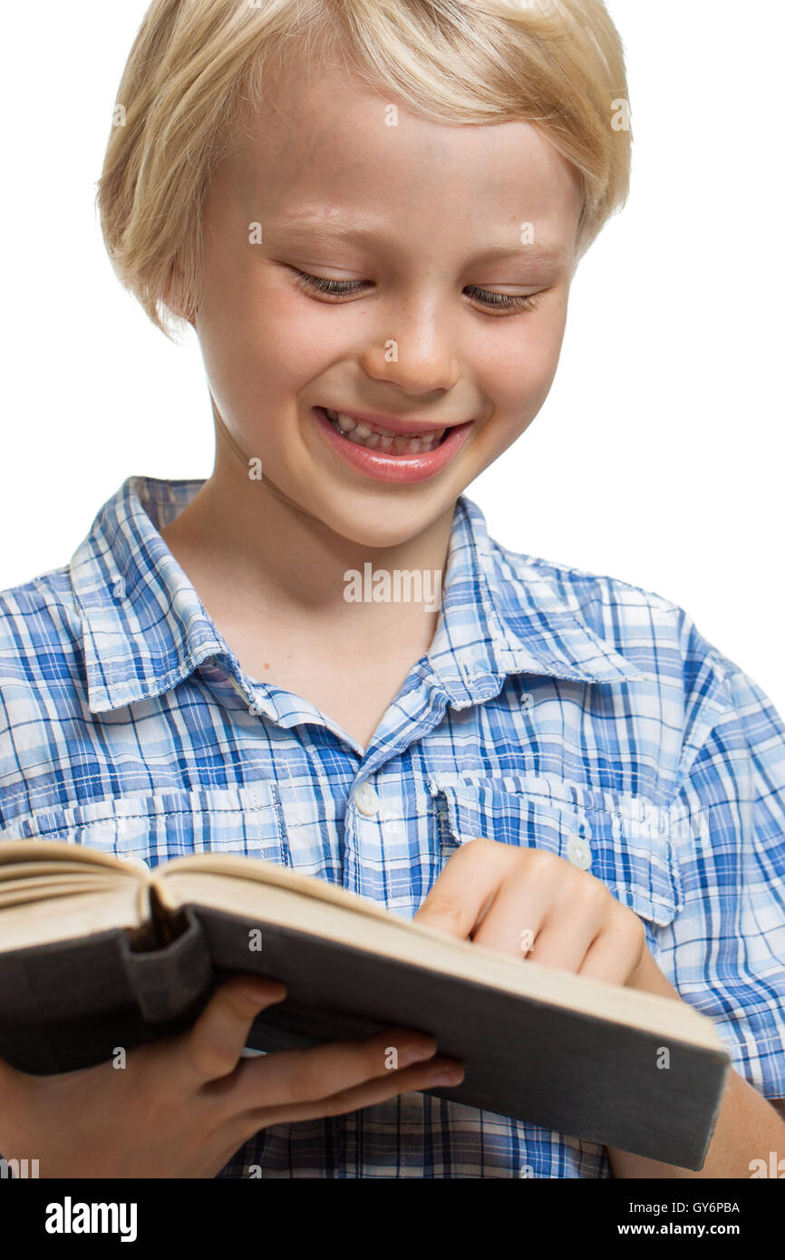 Cute boy reading book Stock Photo - Alamy