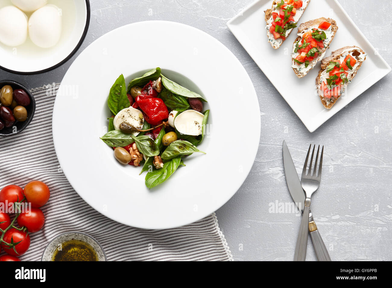 Italian salad and traditional bruschetta Stock Photo - Alamy