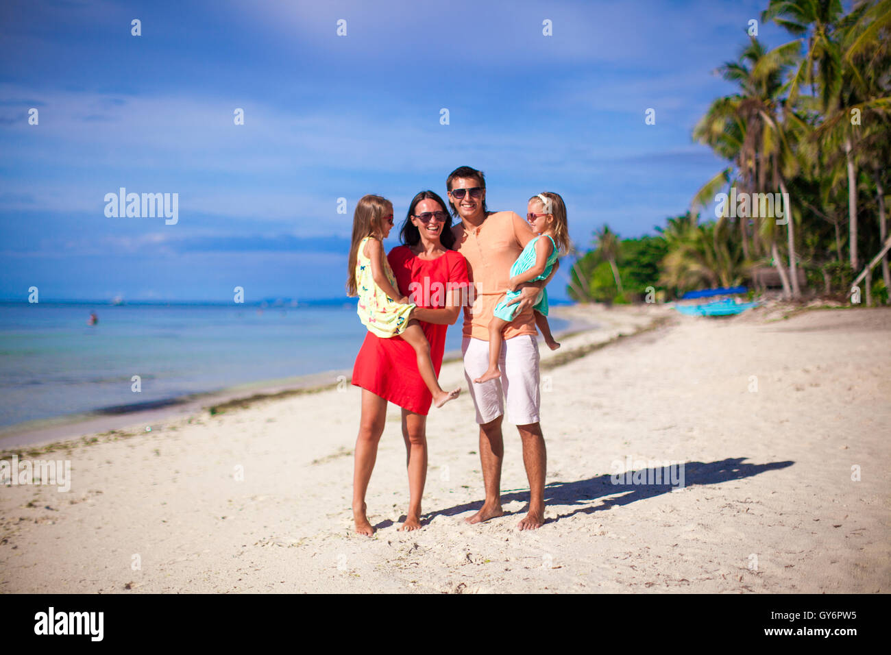 Young family with two kids on summer vacation Stock Photo - Alamy