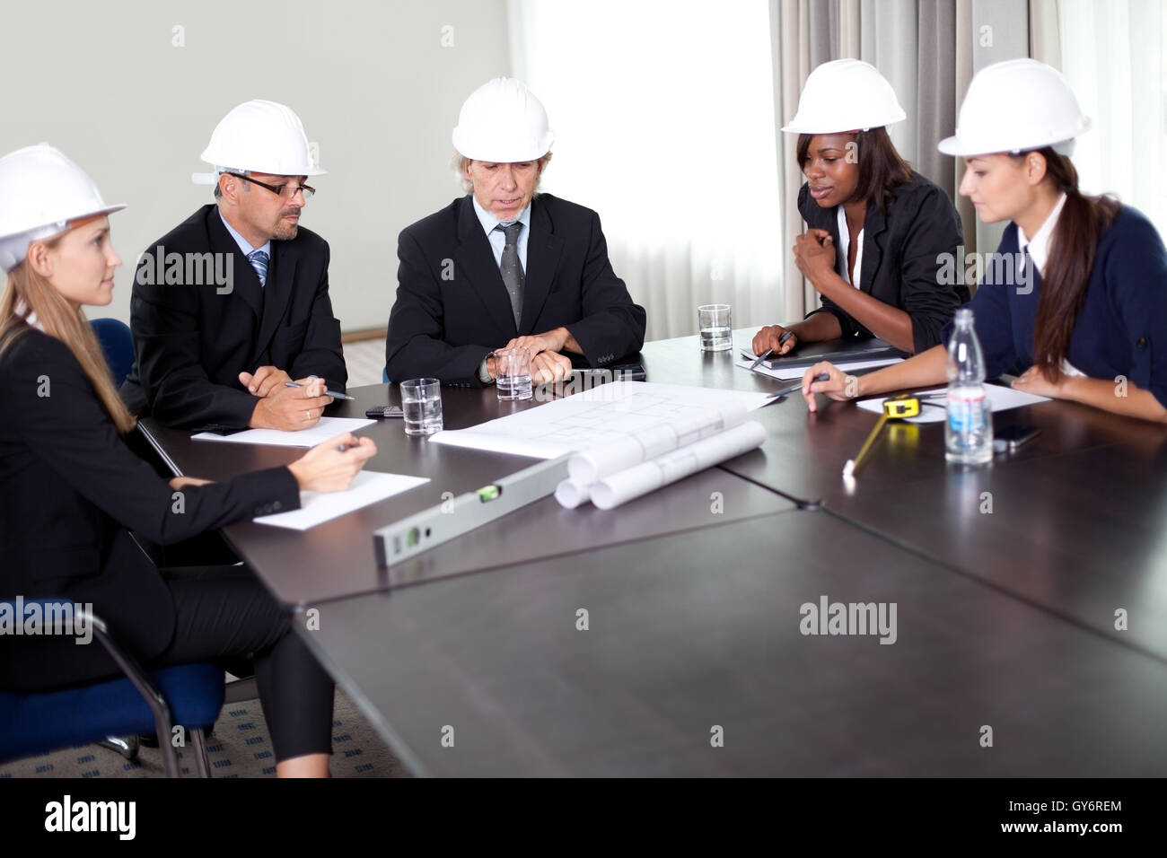 Group of engineers working together Stock Photo - Alamy