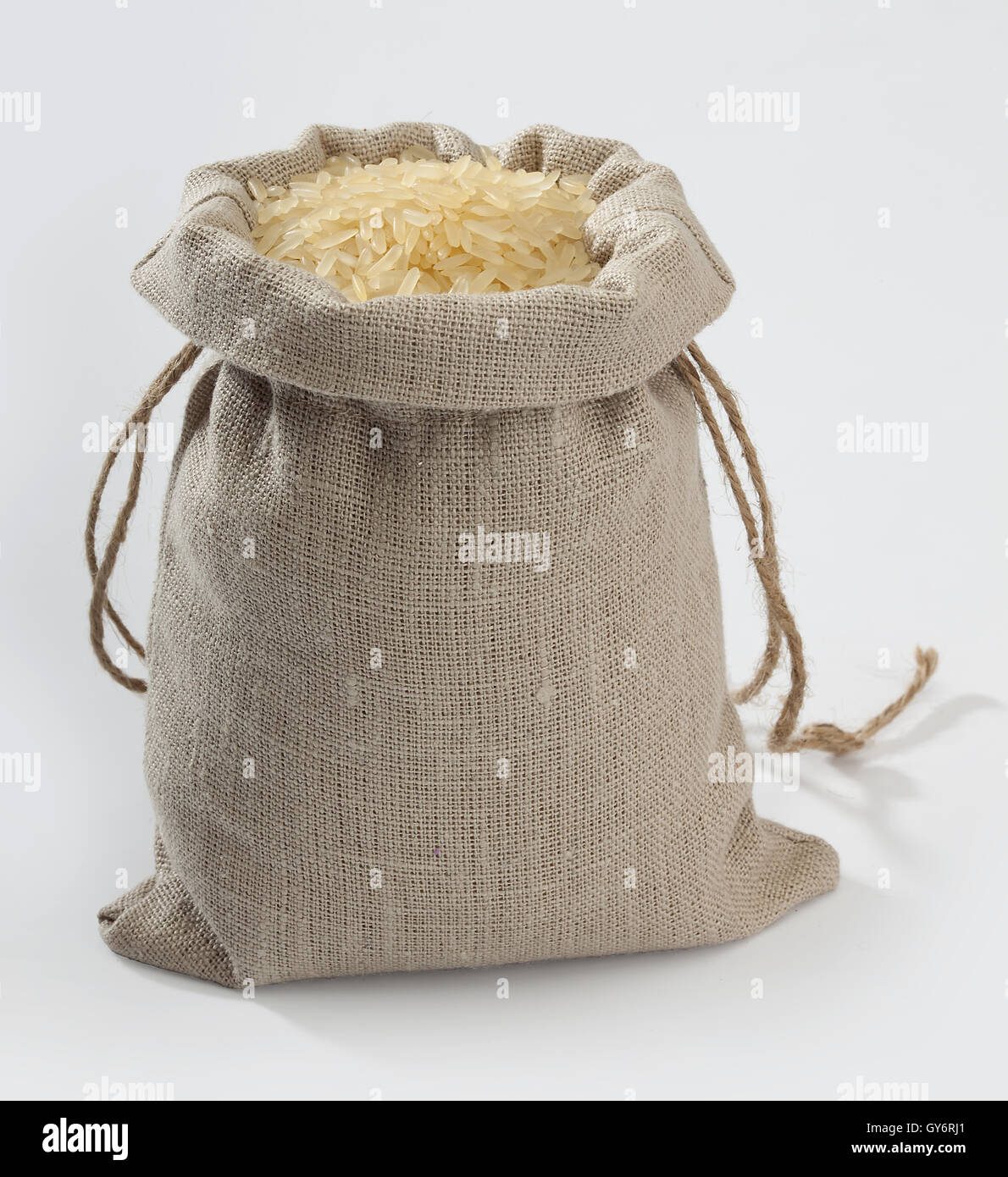 Sack with rice Stock Photo - Alamy