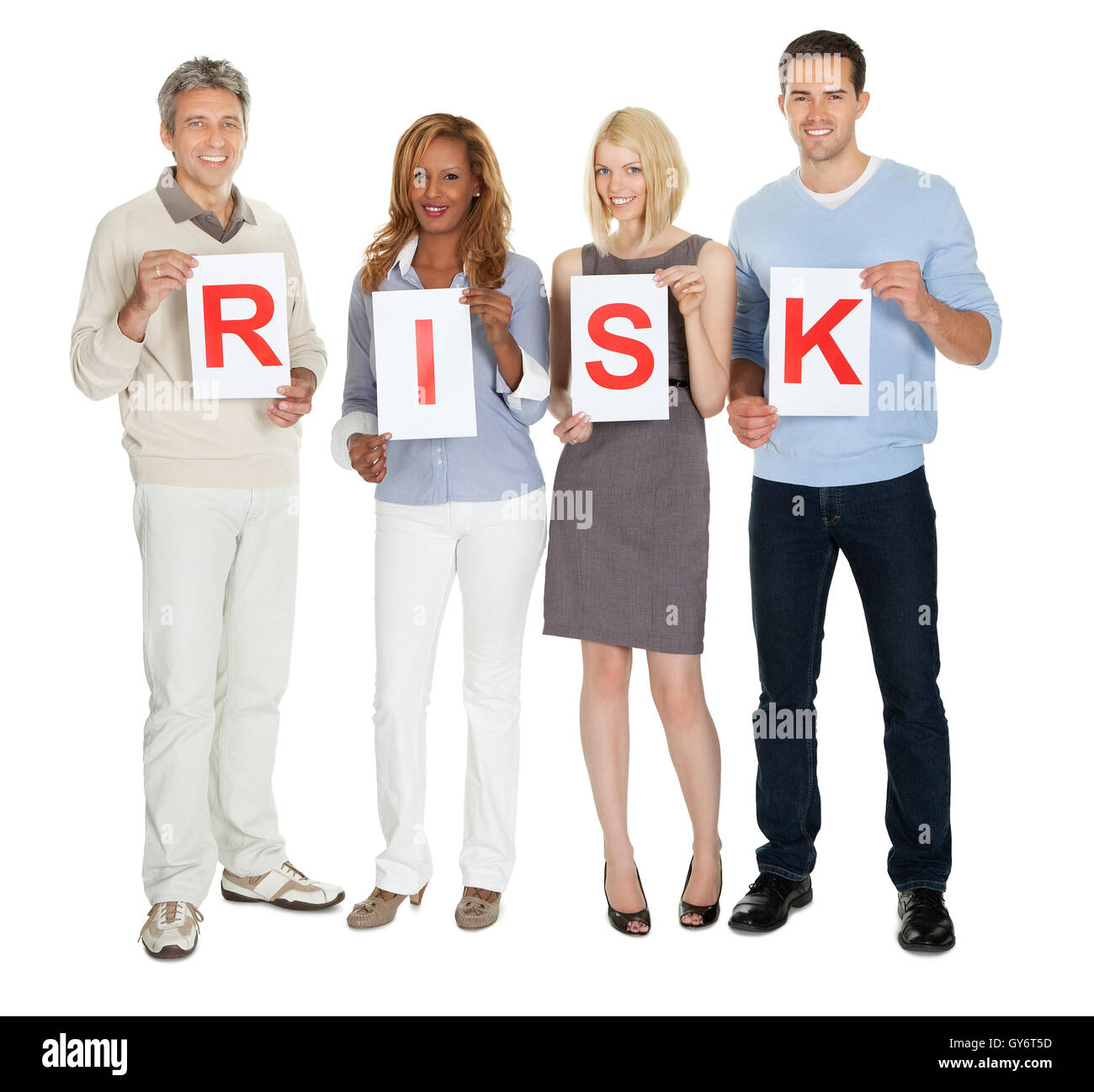 Group of people holding sign board illustrating risk Stock Photo - Alamy