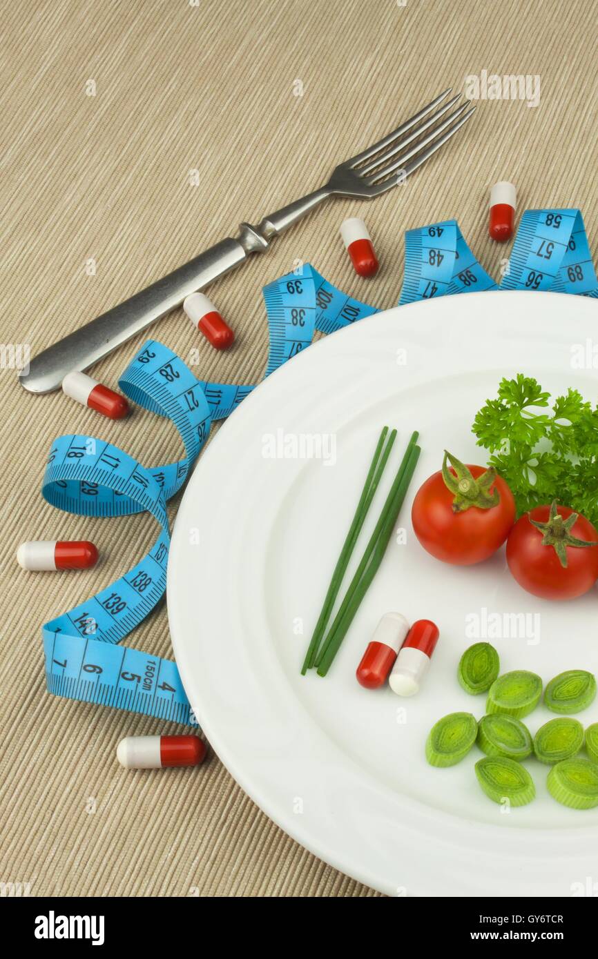 Strict diet against obesity. Dietary vegetable diet. Tomatoes on a ...