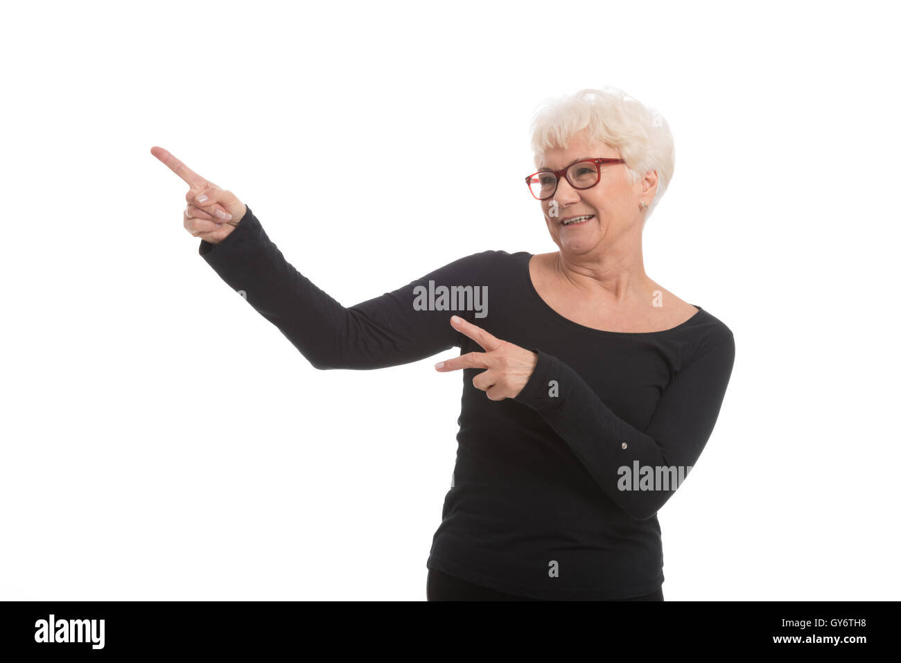 An old happy lady pointing on a copy space Stock Photo - Alamy