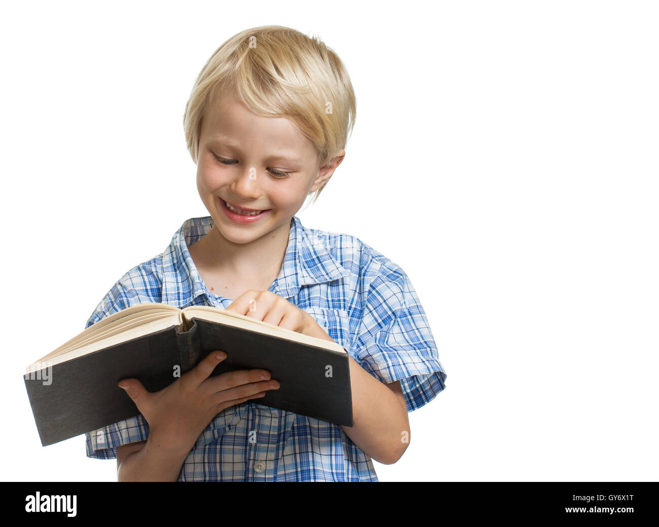 Happy boy reading a book Stock Photo - Alamy