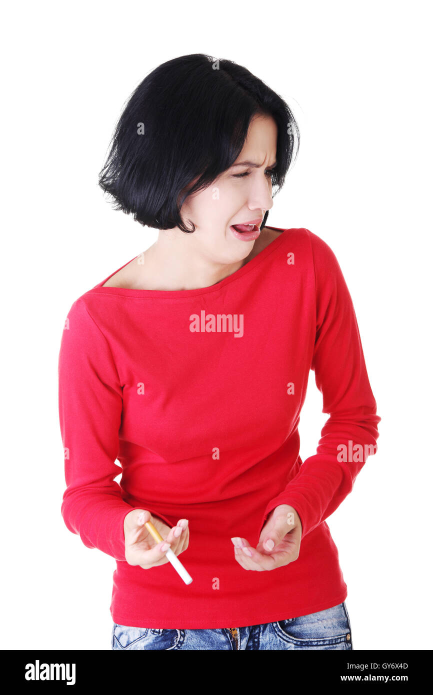 Attractive woman pointing down Stock Photo - Alamy