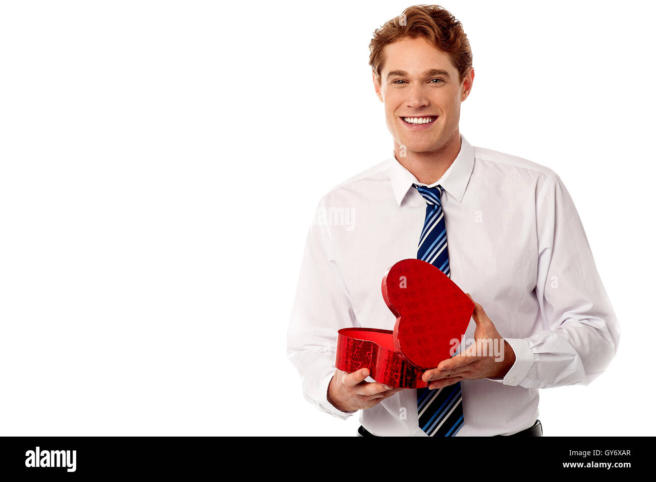 Businessman holding gift box Stock Photo - Alamy
