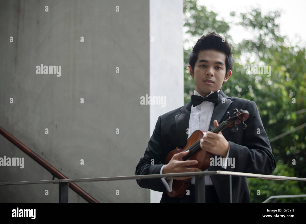 asia man with his violin Stock Photo - Alamy