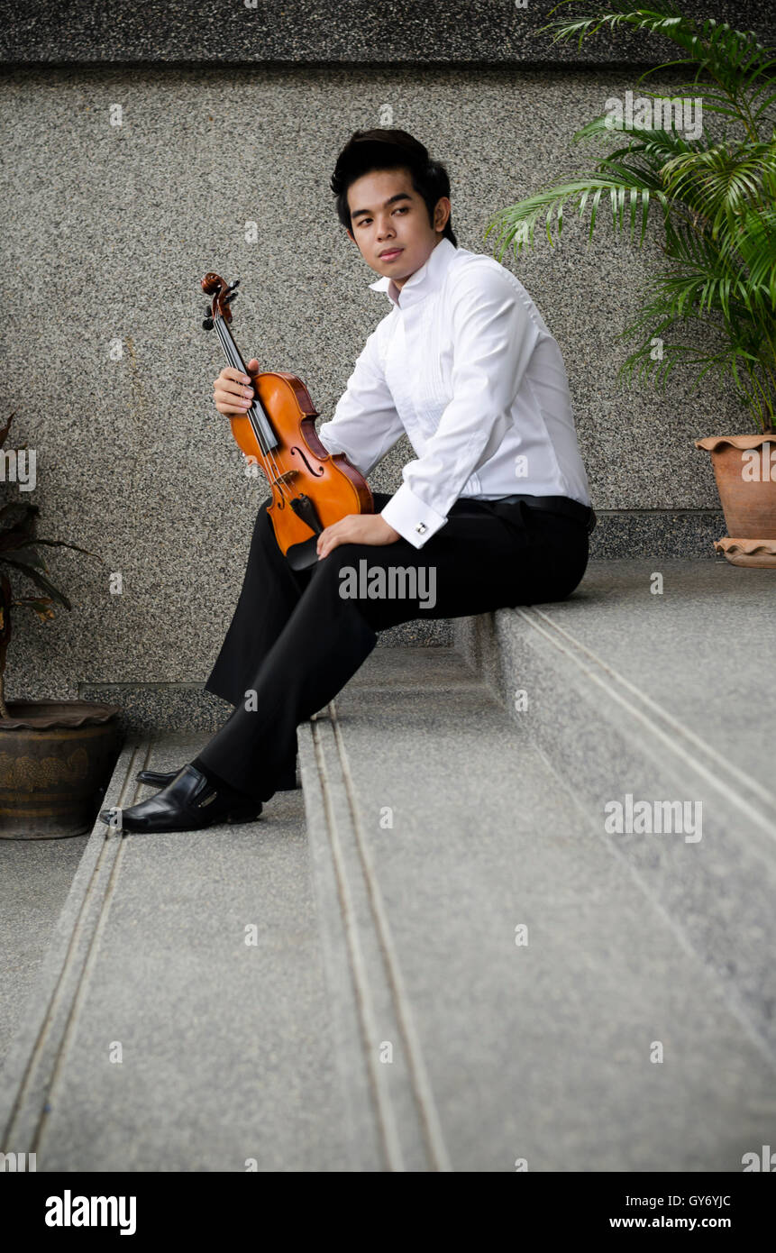 asia man with his violin Stock Photo - Alamy