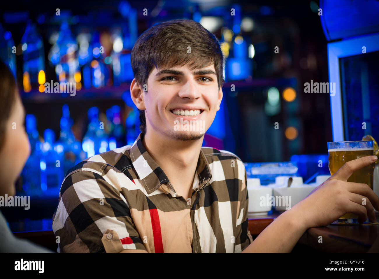 portrait of a young man at the bar Stock Photo - Alamy