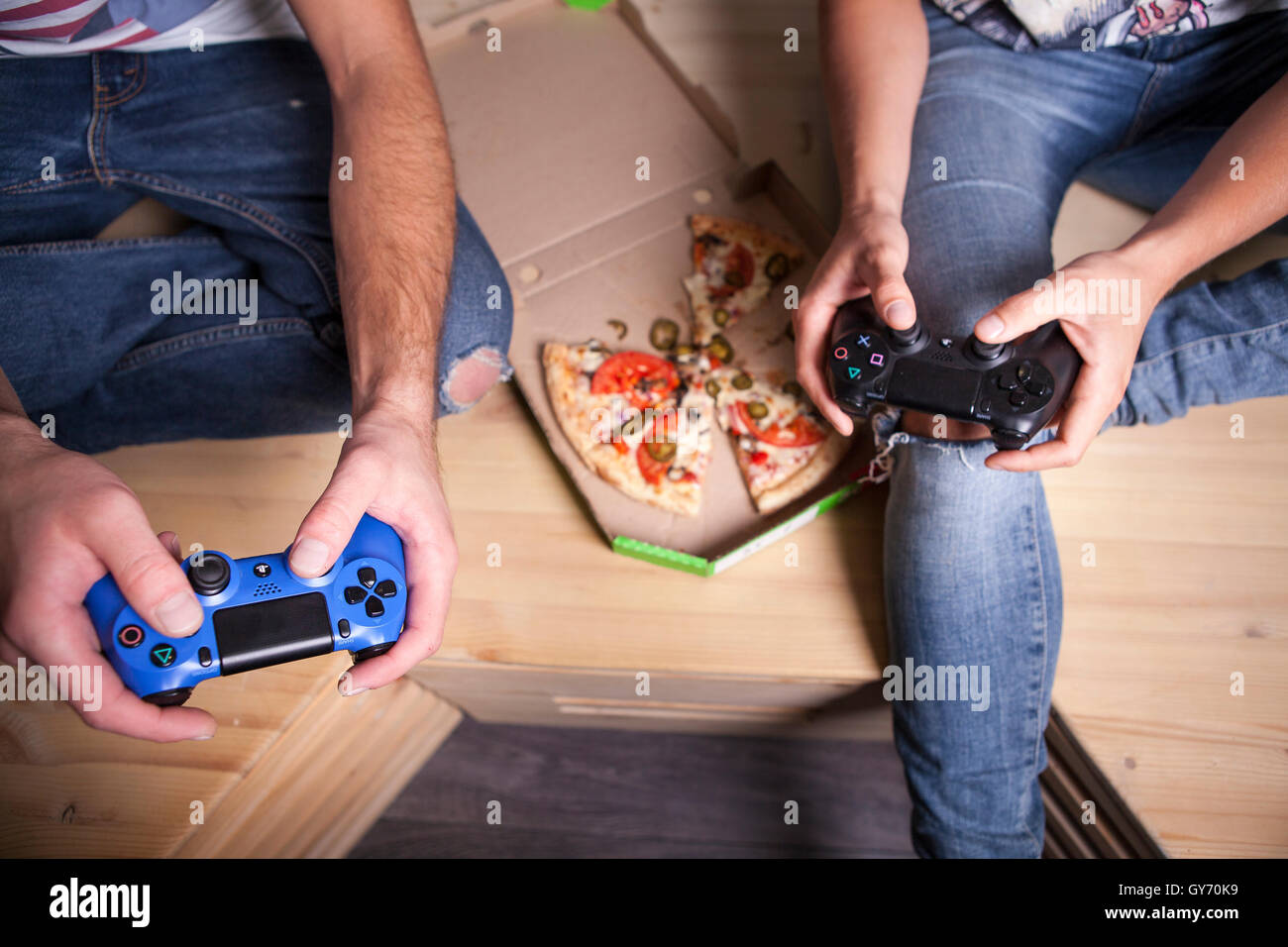 friendship, technology, games and home concept - close up of male ...