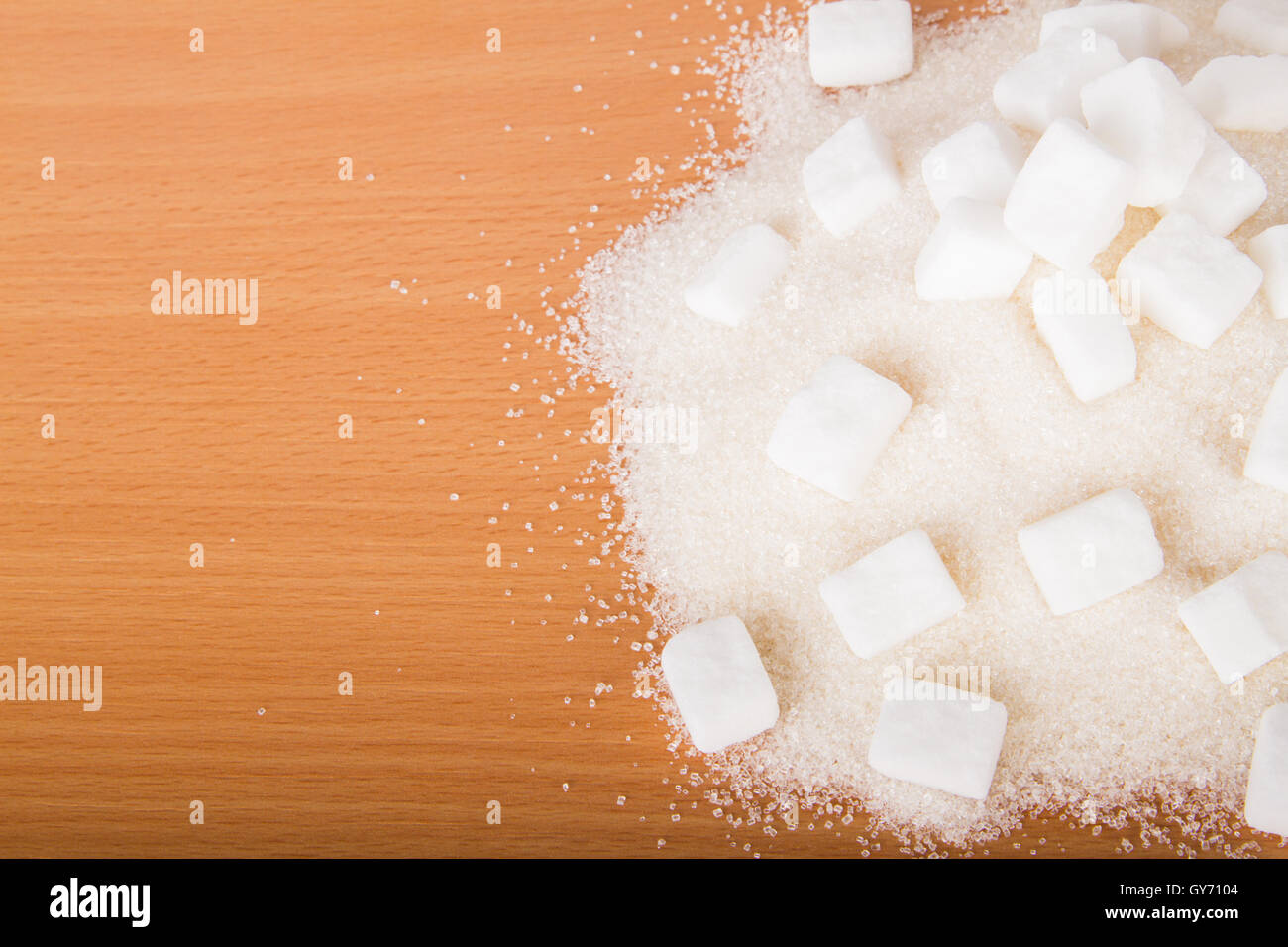 White sugar cubes and crystal sugar Stock Photo - Alamy