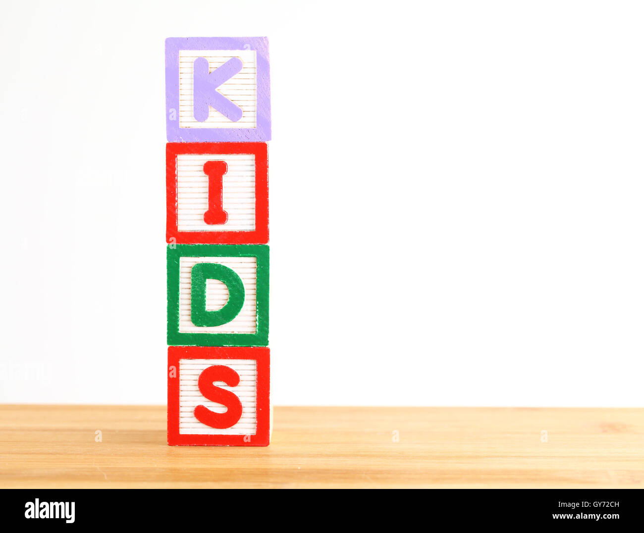 Alphabet building blocks that spelling the word kids Stock Photo - Alamy