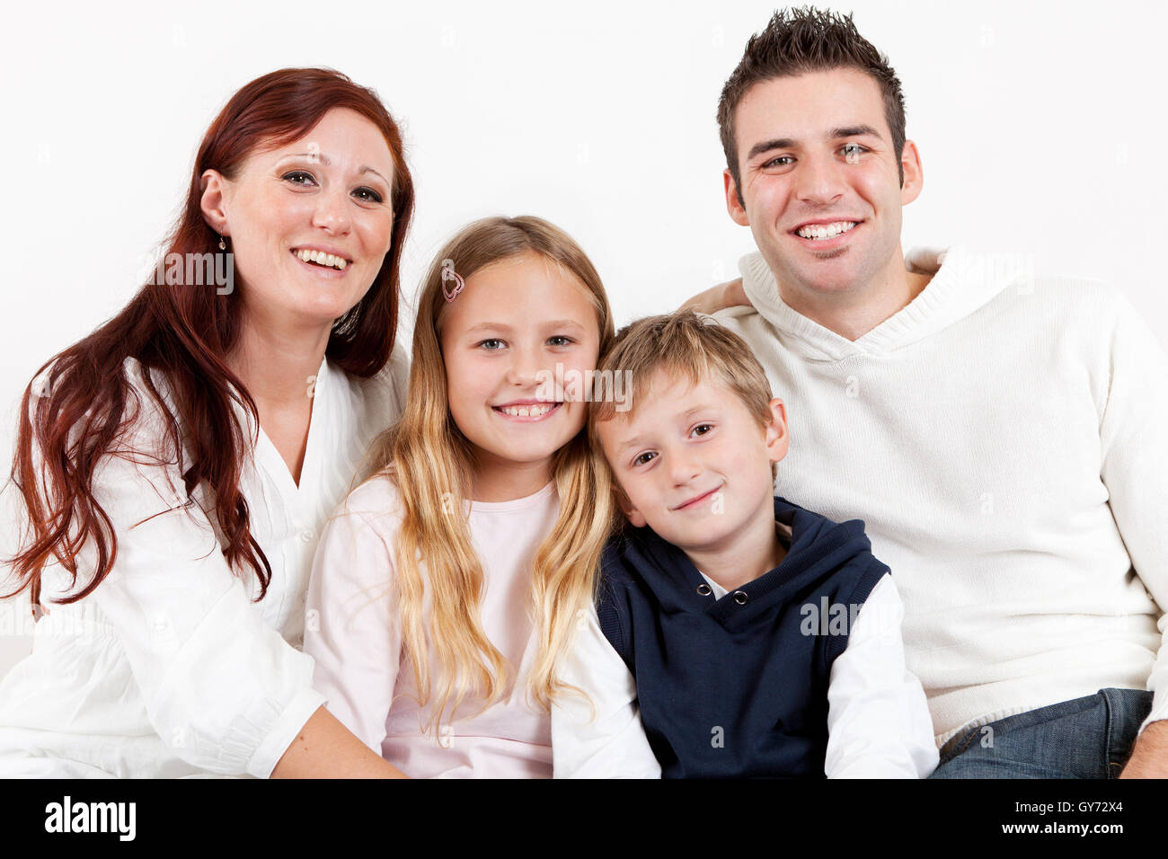 Happy family with their children Stock Photo - Alamy