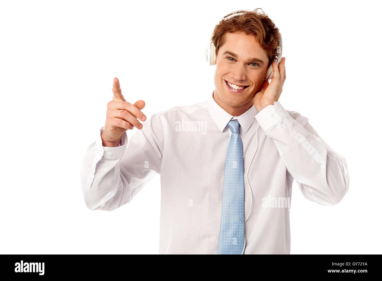 Guy enjoying music isolated over white Stock Photo - Alamy
