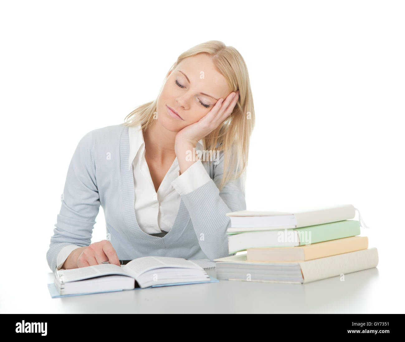 Beautiful student girl tired from doing homework Stock Photo - Alamy