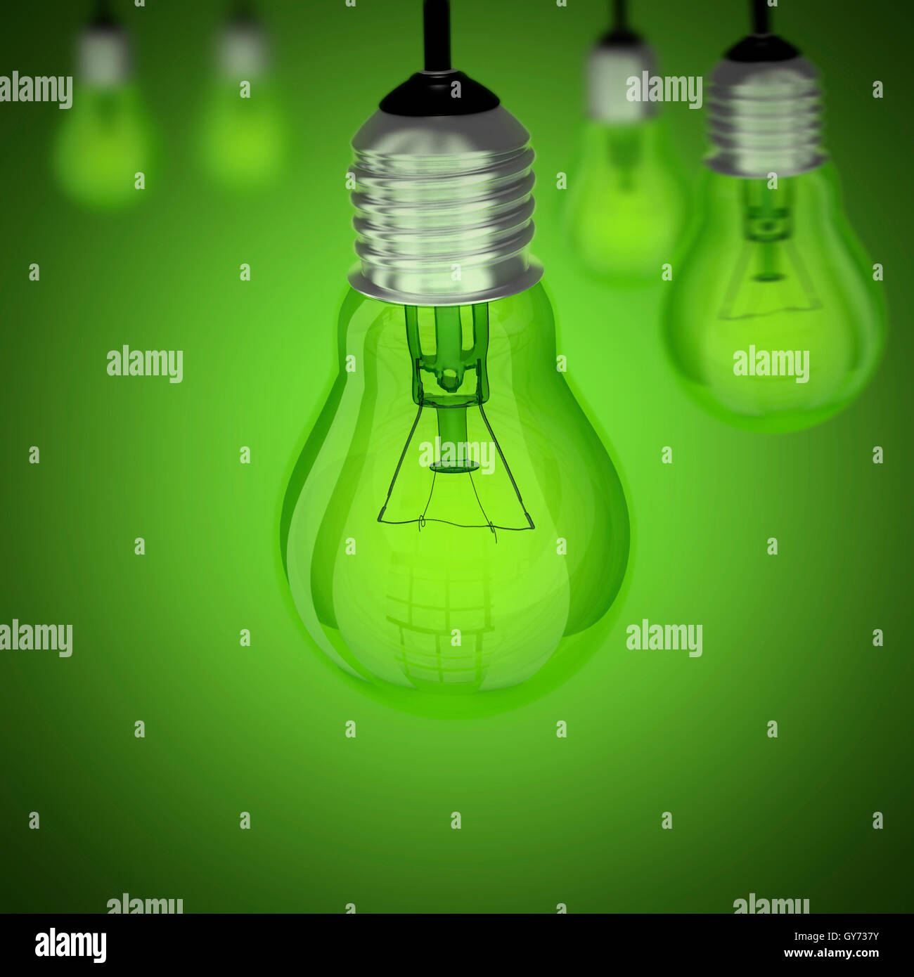 Turned off light bulb on green background Stock Photo - Alamy
