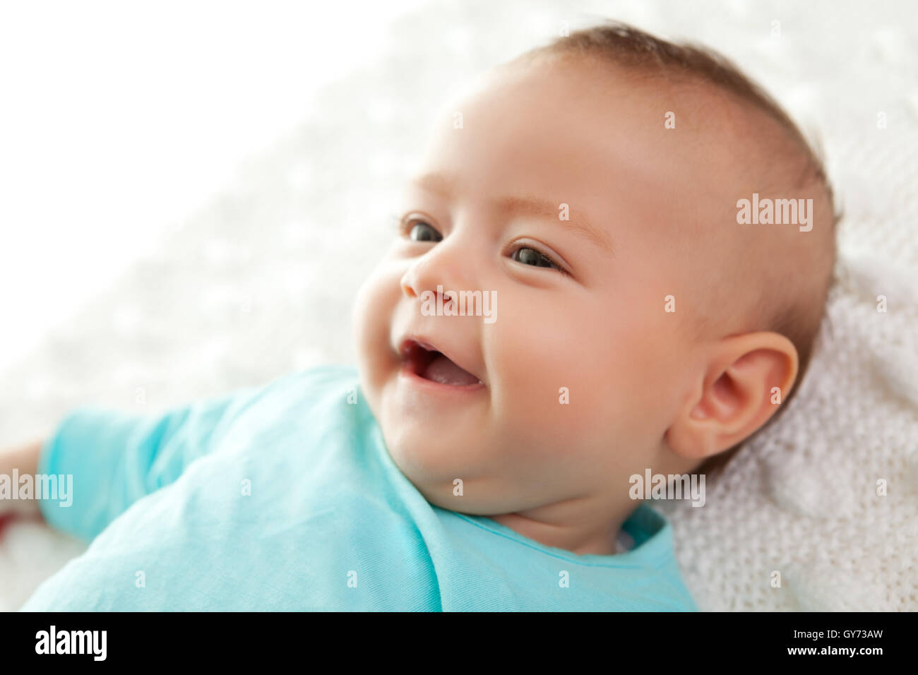 Closeup of a cute little baby smiling Stock Photo - Alamy