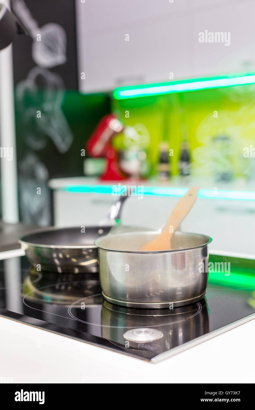 Pan and pot on the stove Stock Photo - Alamy