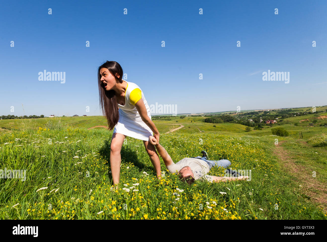 Woman pulling a slapped man Stock Photo - Alamy
