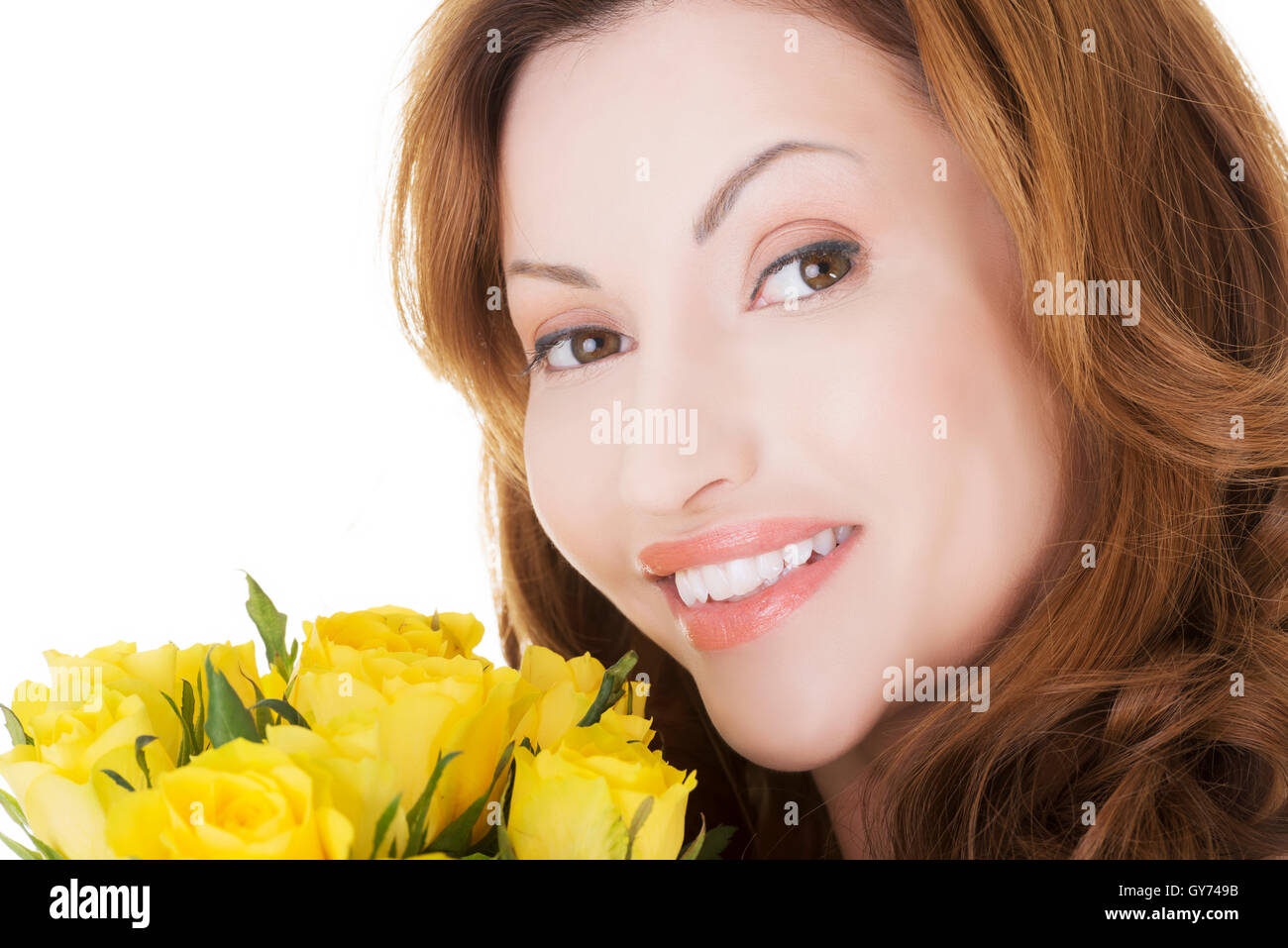 Attractive casual woman with yellow roses Stock Photo - Alamy
