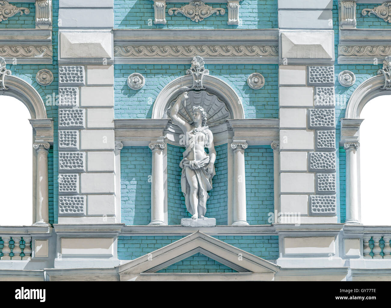 Old Statue of a saint on a blue brick wall Stock Photo - Alamy
